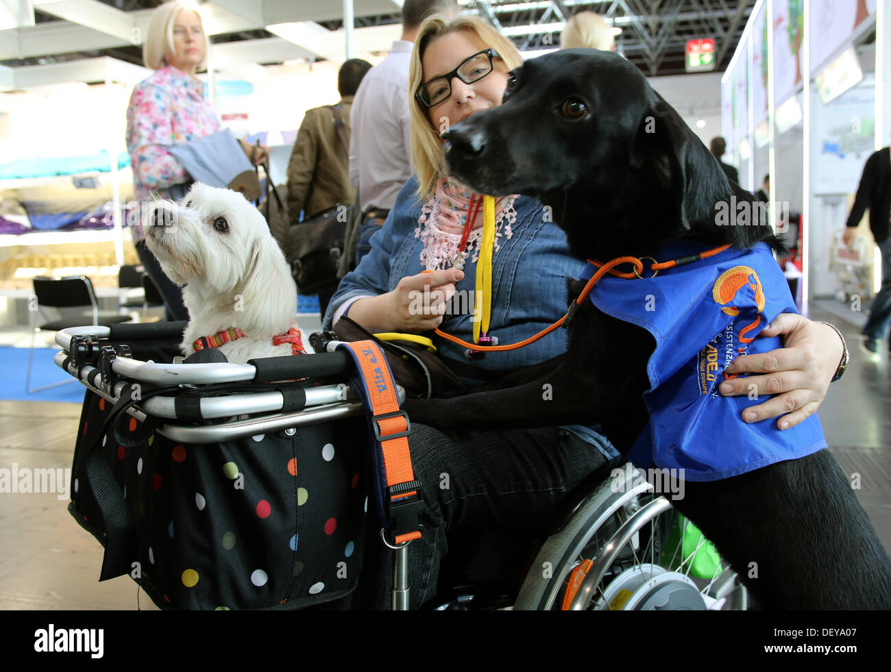 Assistant dog Rocko looks after her disabled master at their expo stand ...