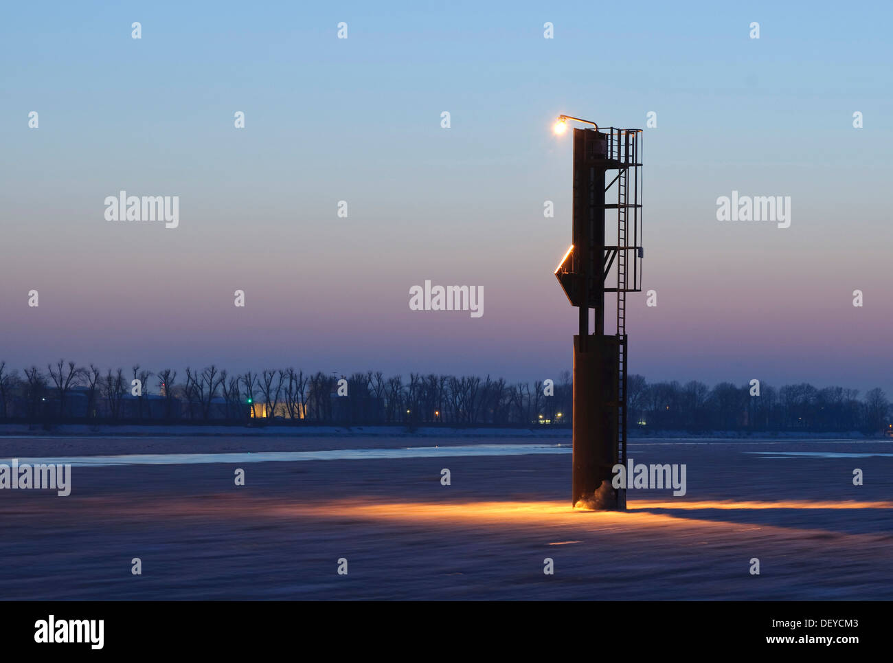 Illuminated beacon on the wintery river Elbe near Hamburg Stock Photo ...