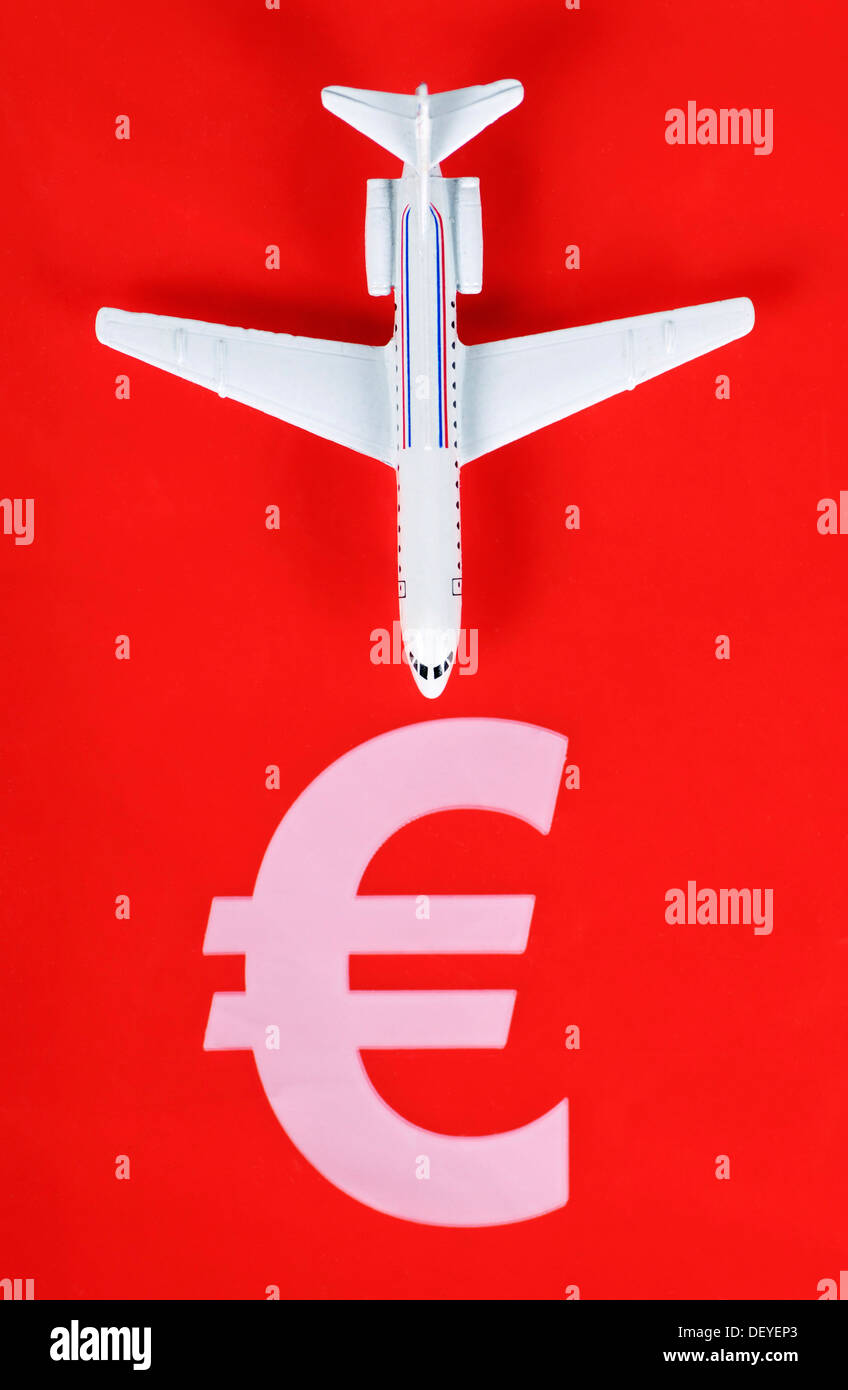 Miniature aircraft and euro sign, cheap airlines Stock Photo - Alamy
