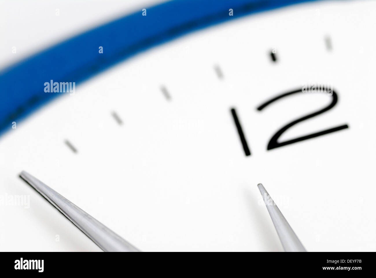 Clock showing almost high noon Stock Photo - Alamy