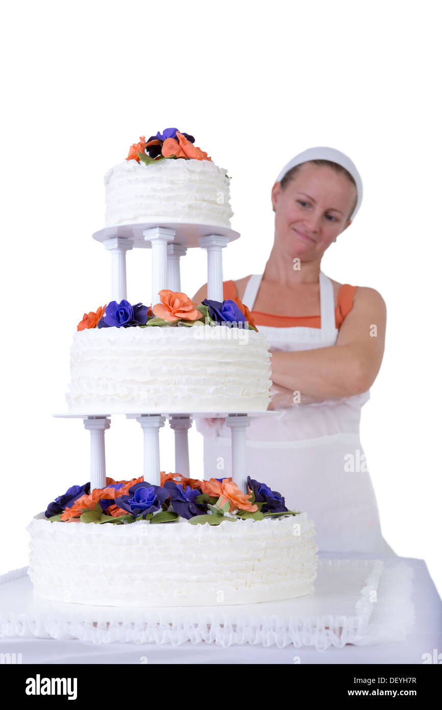Baker lady giving to a wedding cake latest proud look in her apron and ...