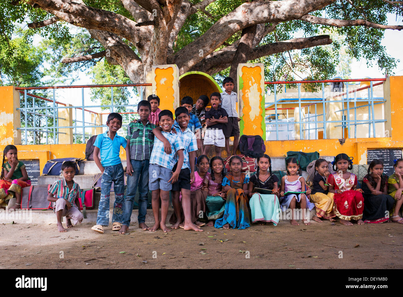Happy young rural Indian village school children waiting to go into ...