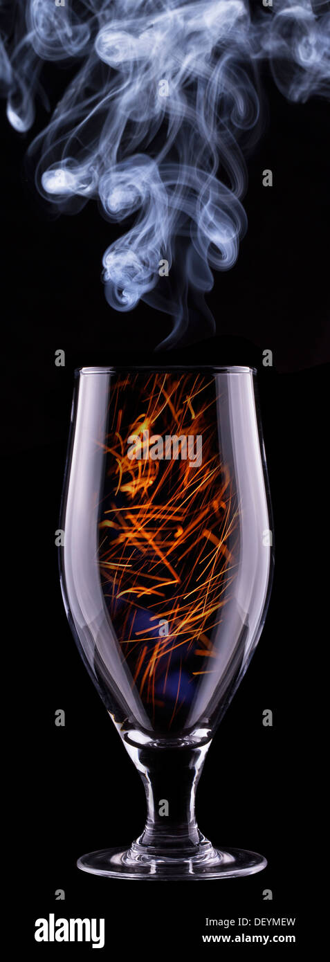fire in a glass on a black background Stock Photo - Alamy