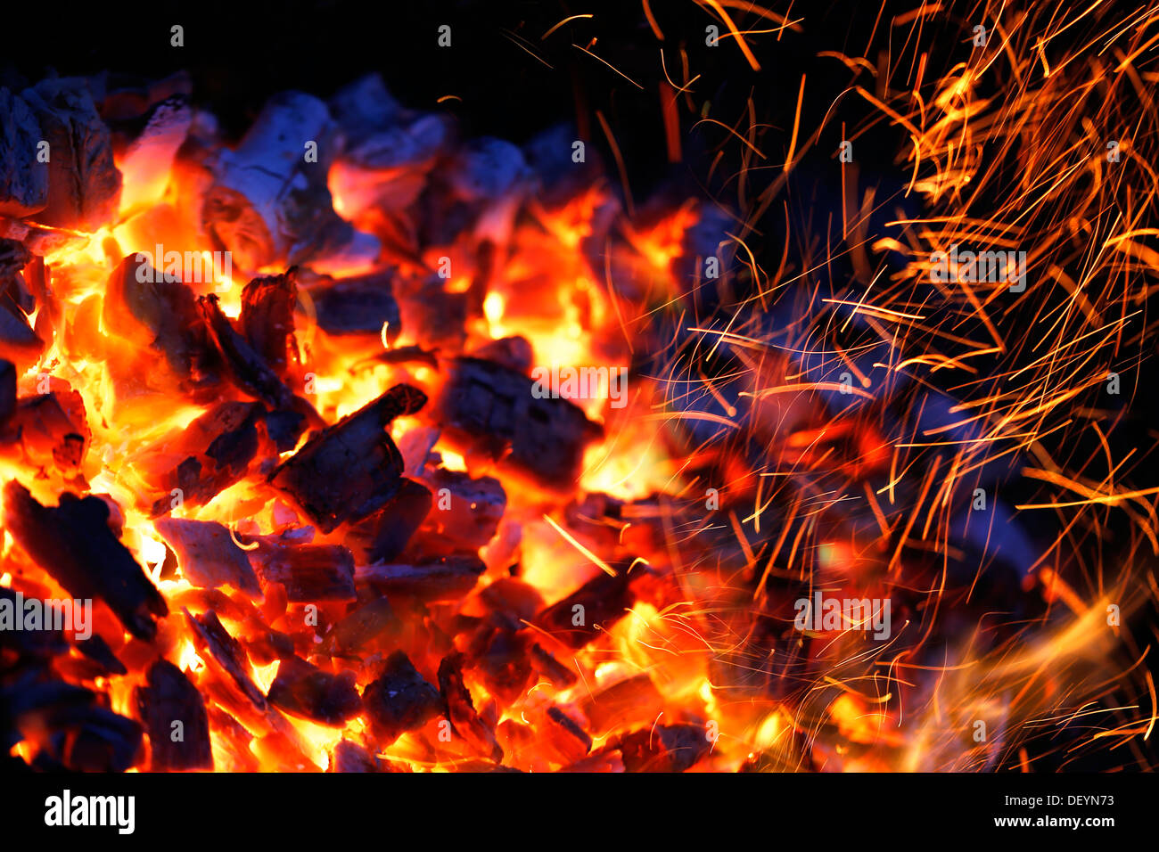 burning charcoal background with fire and sparks Stock Photo - Alamy