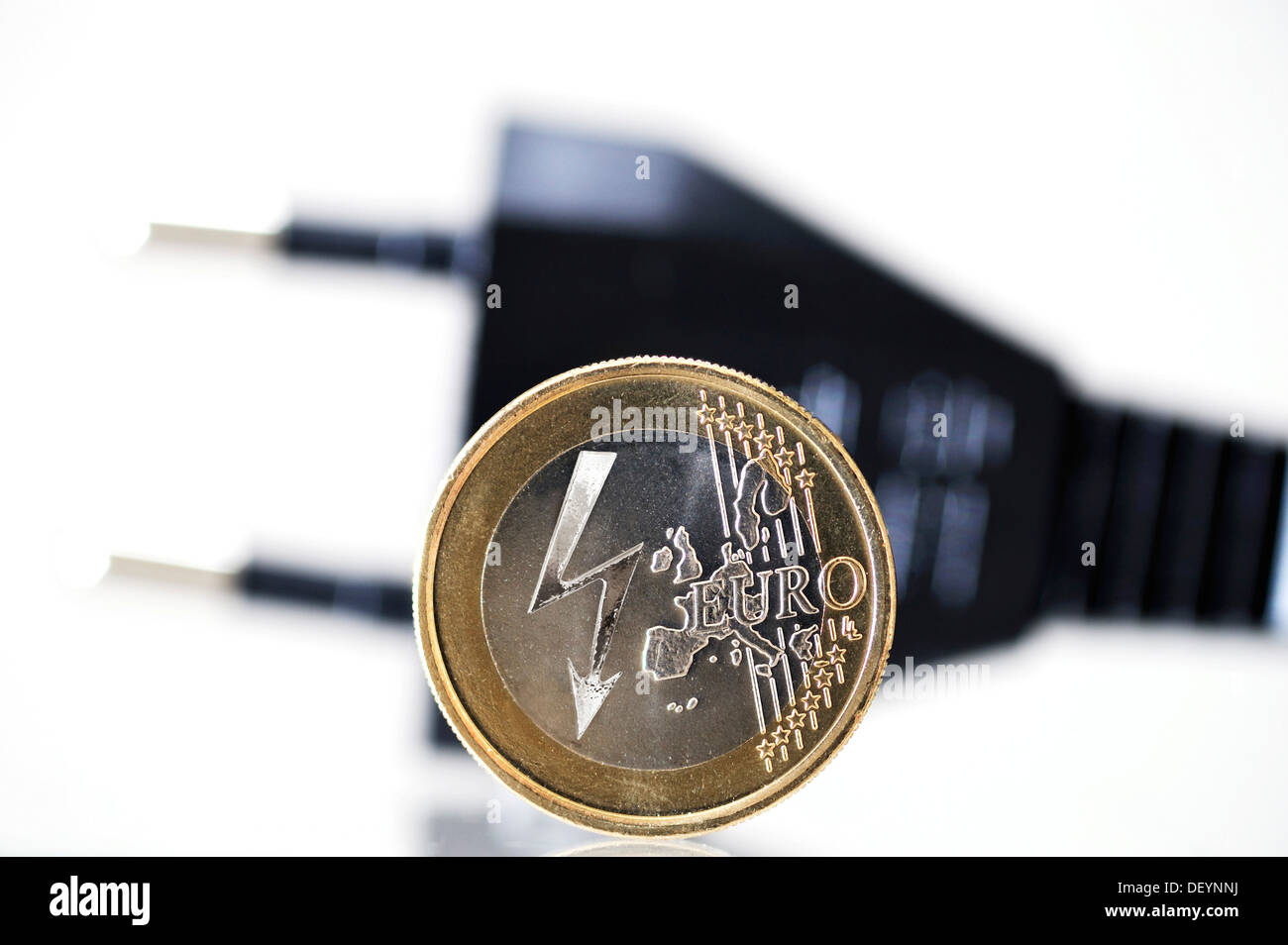 One euro coin with a lightening bolt power symbol in front of a power ...