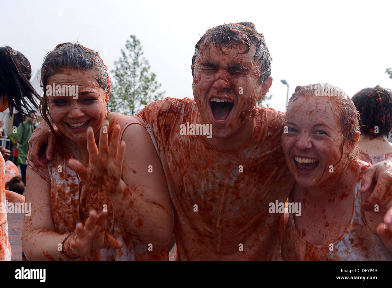London, UK. 25th Sep, 2013. Competitors throwing tomatoes at each other ...