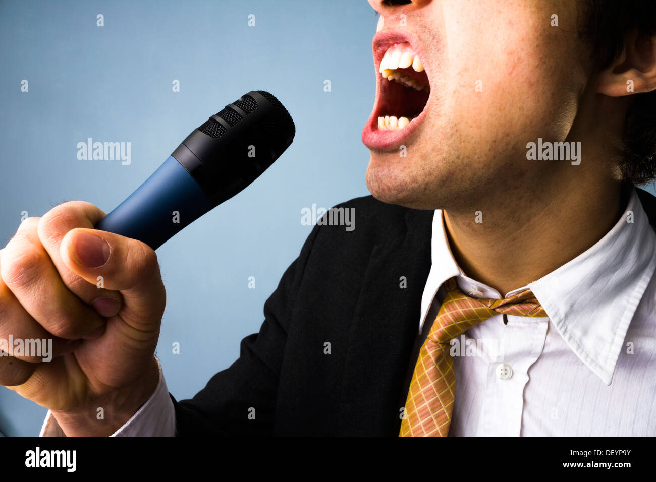 Businessman singing microphone hi-res stock photography and images - Alamy