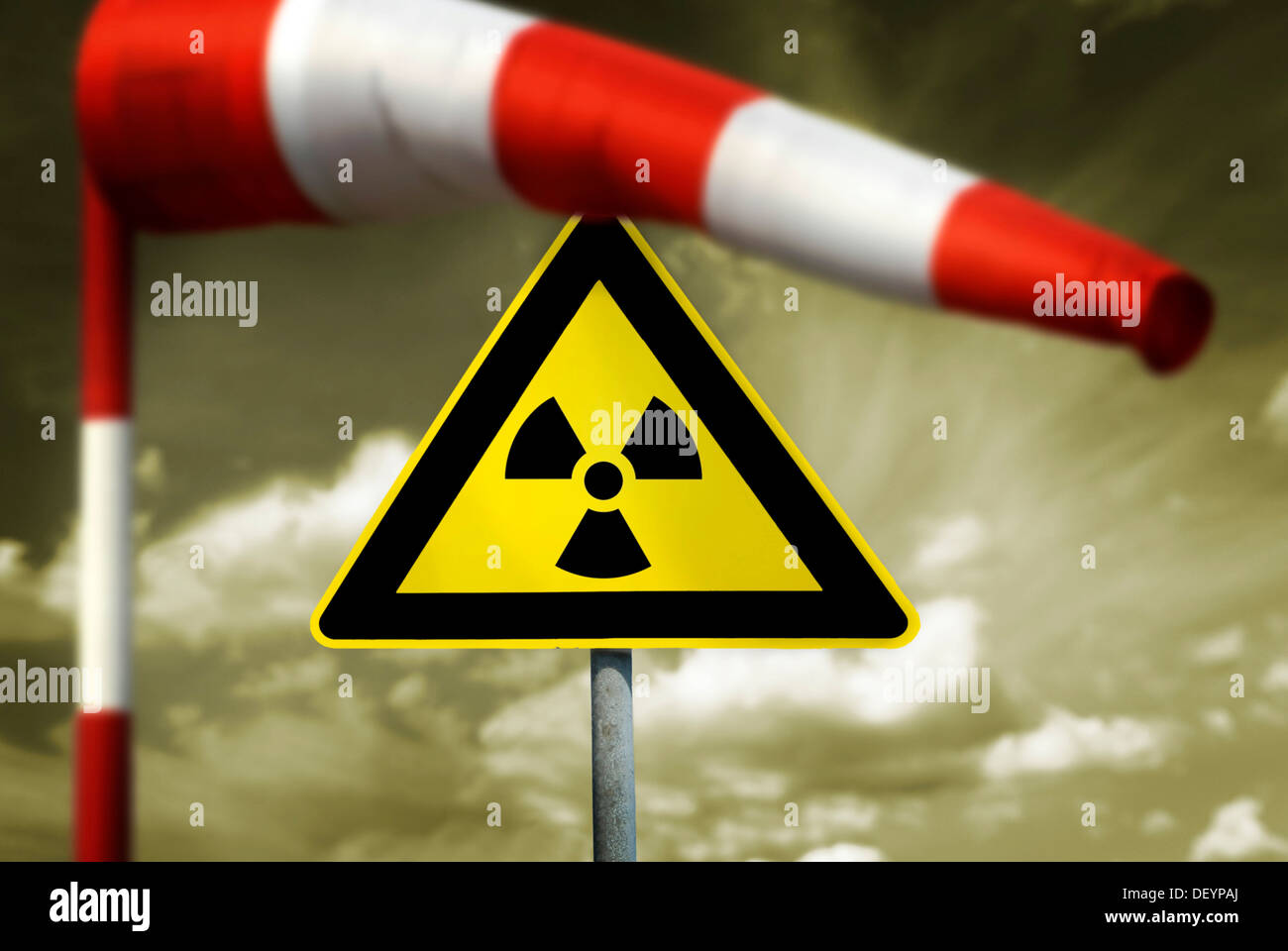 Radioactivity sign and a wind vane, radioactive cloud Stock Photo - Alamy