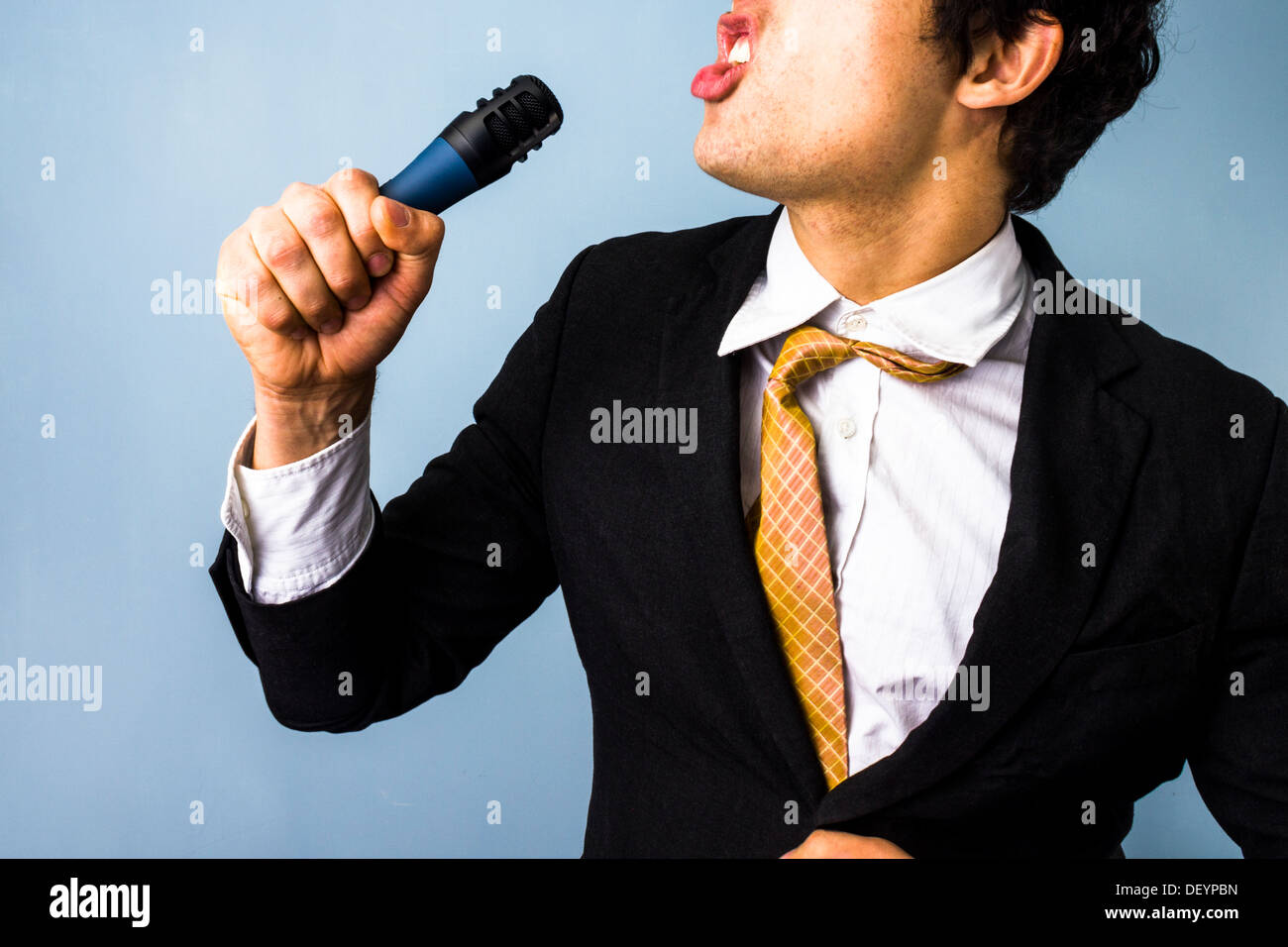Businessman singing microphone hi-res stock photography and images - Alamy