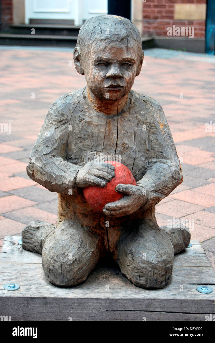 Boy with a ball, wooden sculpture, artist Peter Nettesheim, Borken ...