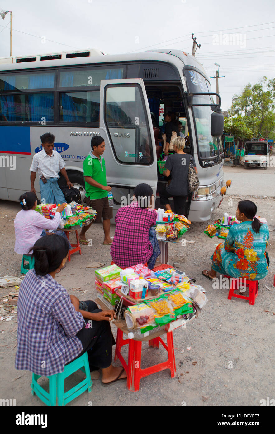 Vendors wait for a sale at the bus station in Mandalay, Burma Stock ...