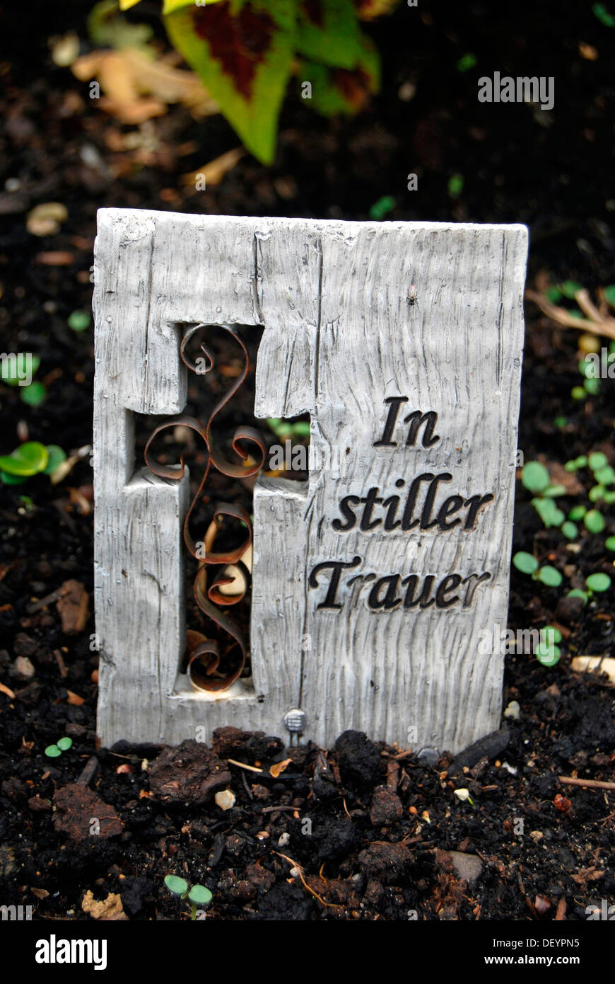 Wooden boad with text In stiller Trauer or in silent mourning, cross ...