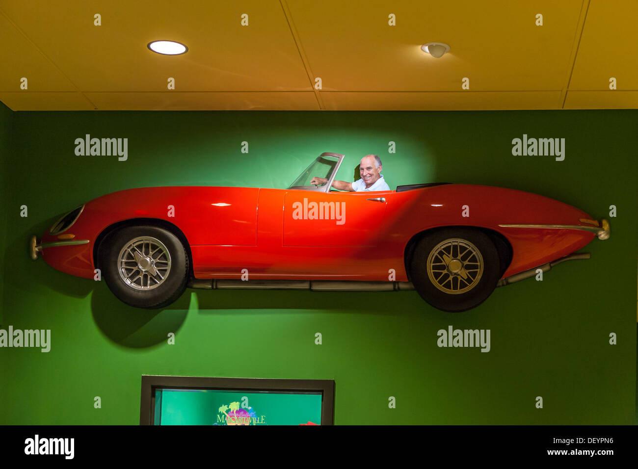 Jimmy Buffett character in sports car over valet window at Jimmy ...