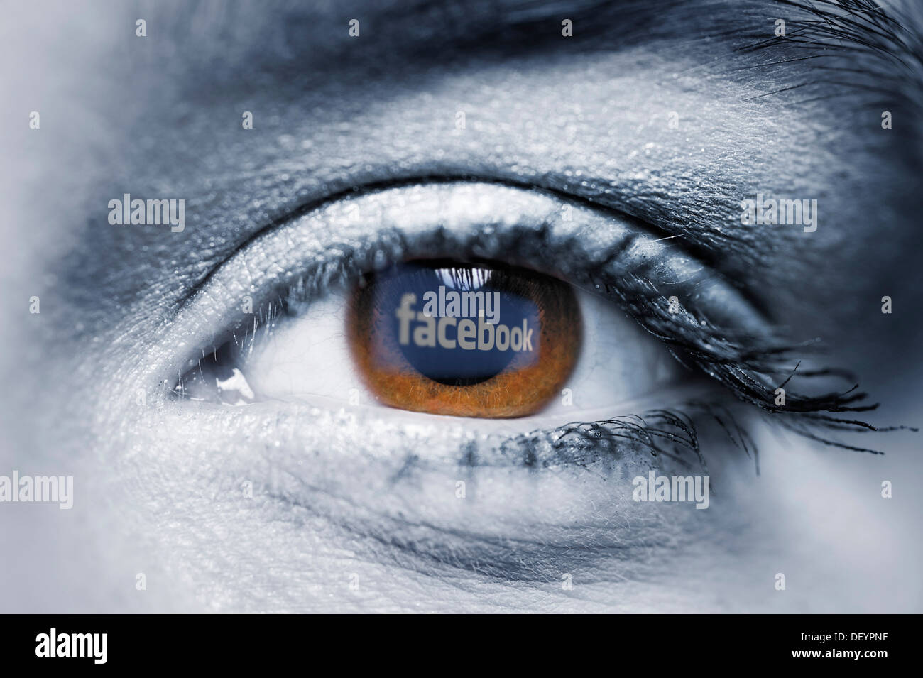 Woman's eye with the reflection of the Facebook logo Stock Photo - Alamy
