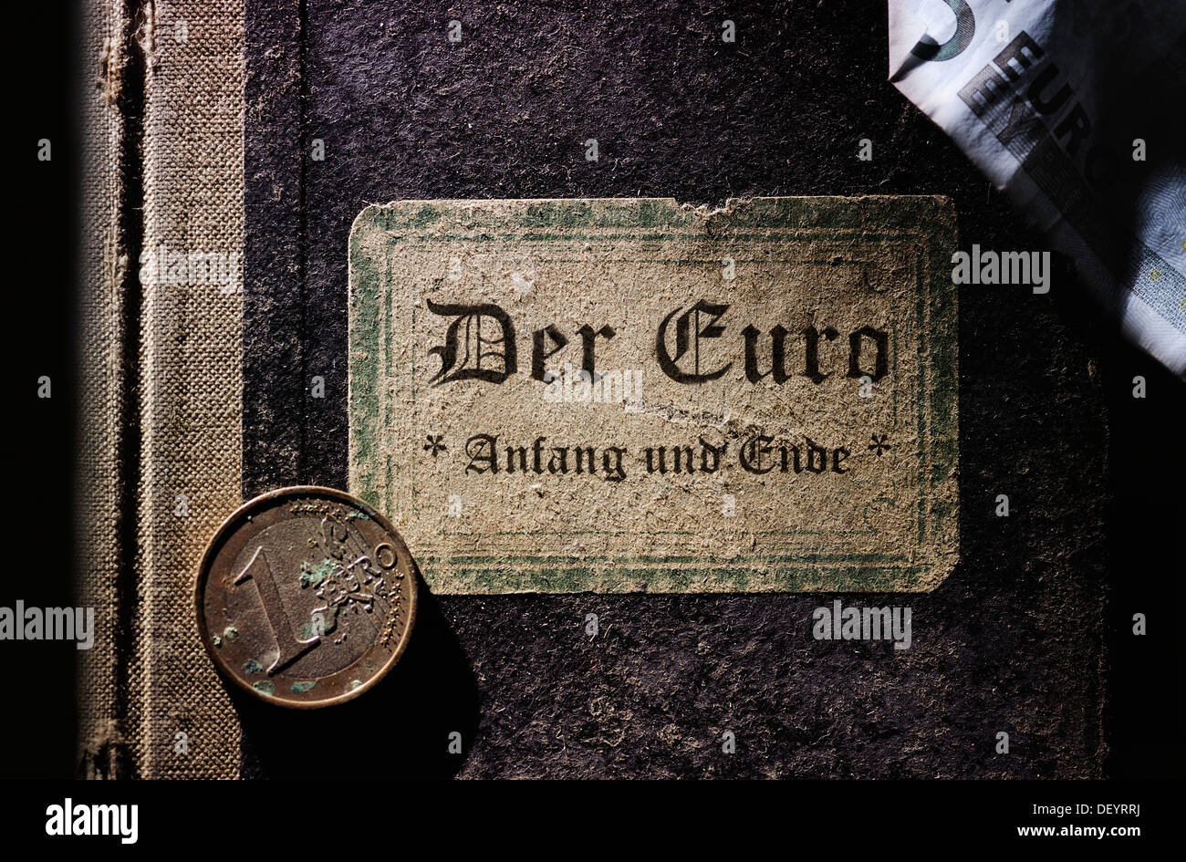 Old book with the inscription, Der Euro – Anfang und Ende, German for ...