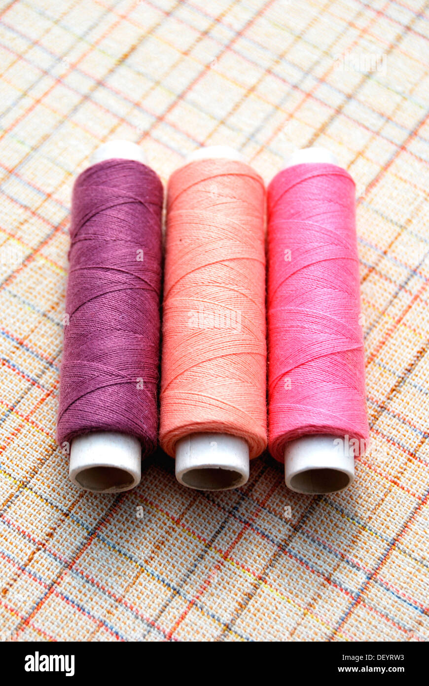 Yarn, cotton reels, spools of thread, pink, purple Stock Photo - Alamy