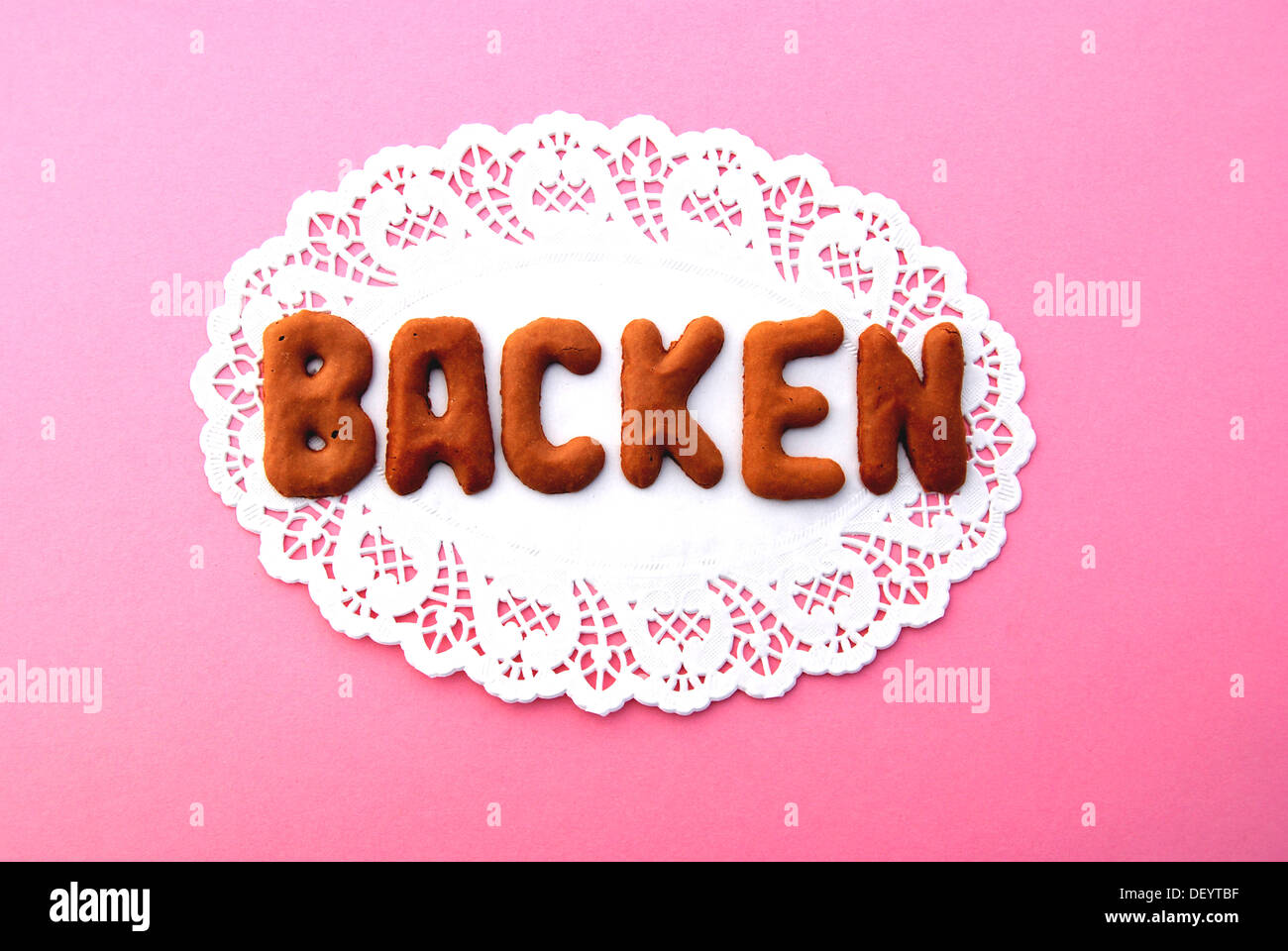 Lettering "Backen", German for "baking", alphabet biscuits on a cake ...