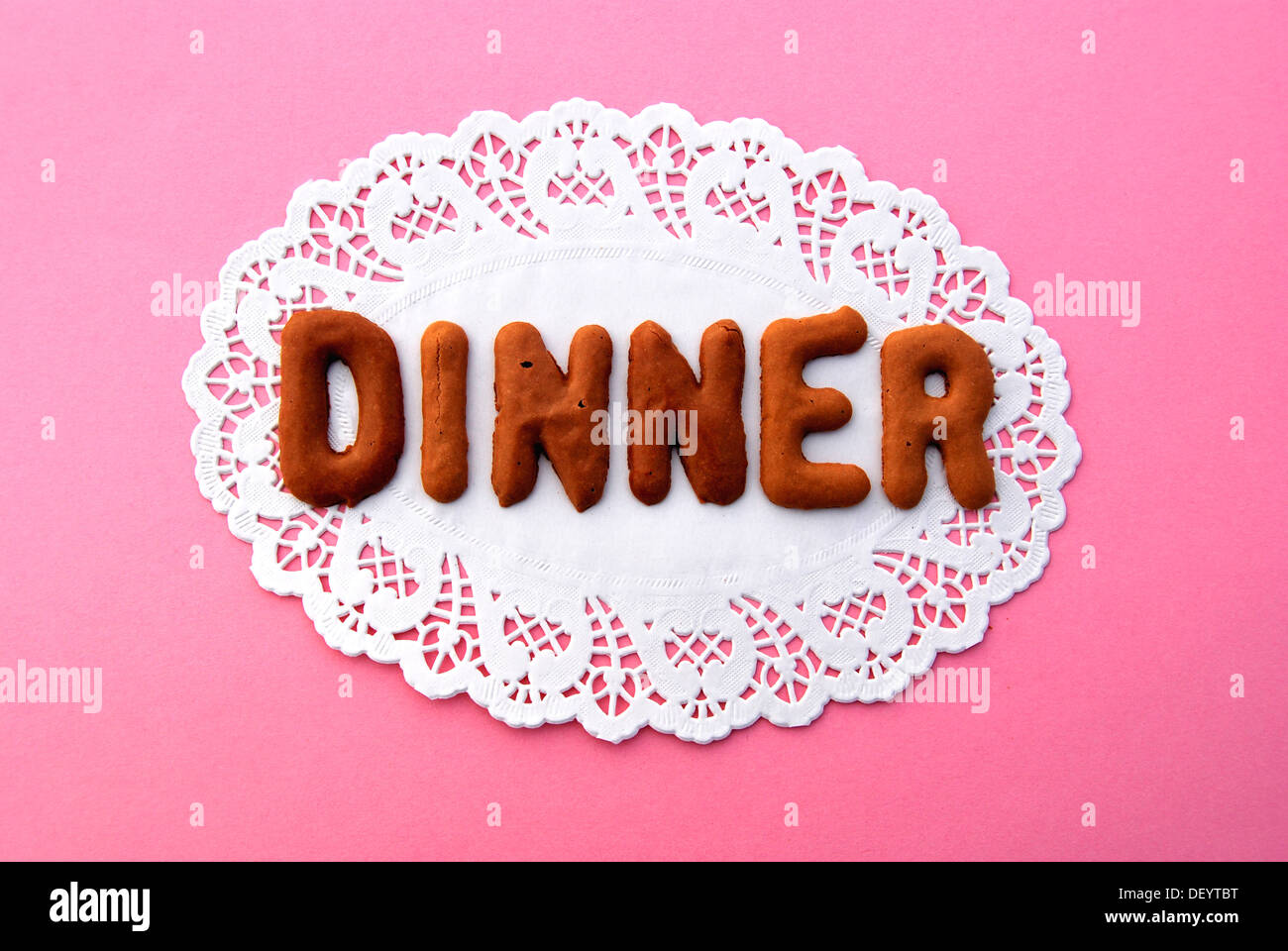 Dinner, lettering, alphabet biscuits on a cake lace coaster Stock Photo ...
