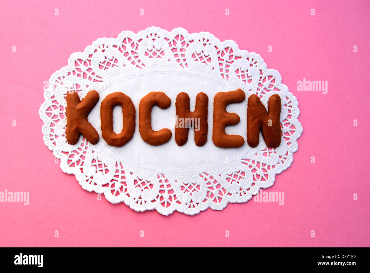 Lettering "Kochen", German for "cooking", alphabet biscuits on a cake ...