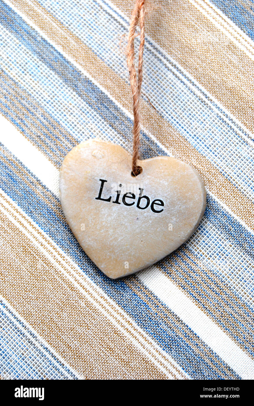 Lettering "Liebe", German for "love" on a heart of stone Stock Photo ...