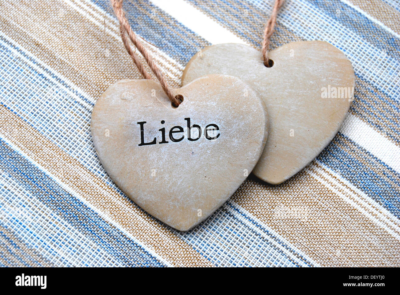 Two hearts of stone, lettering "Liebe", German for "love", symbolic ...