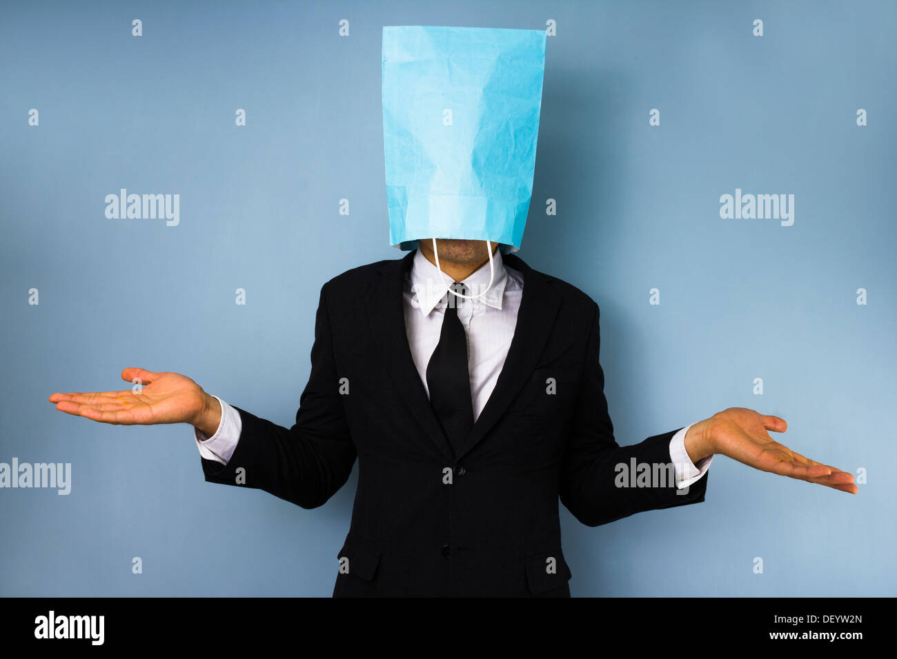 Confused businessman with a paper bag over his head Stock Photo - Alamy