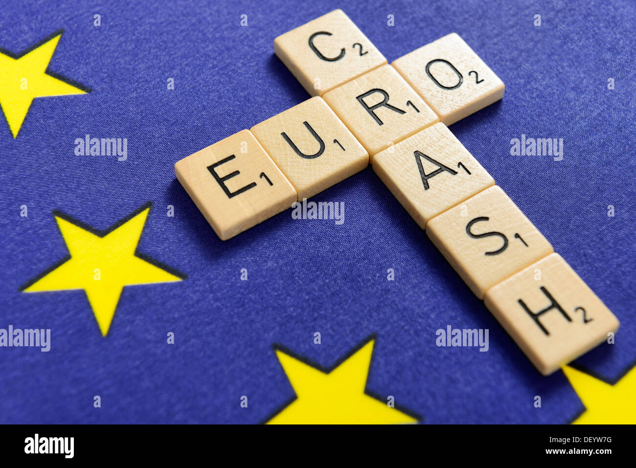 Lettering "Euro Crash", Scrabble letters lying on an European flag ...