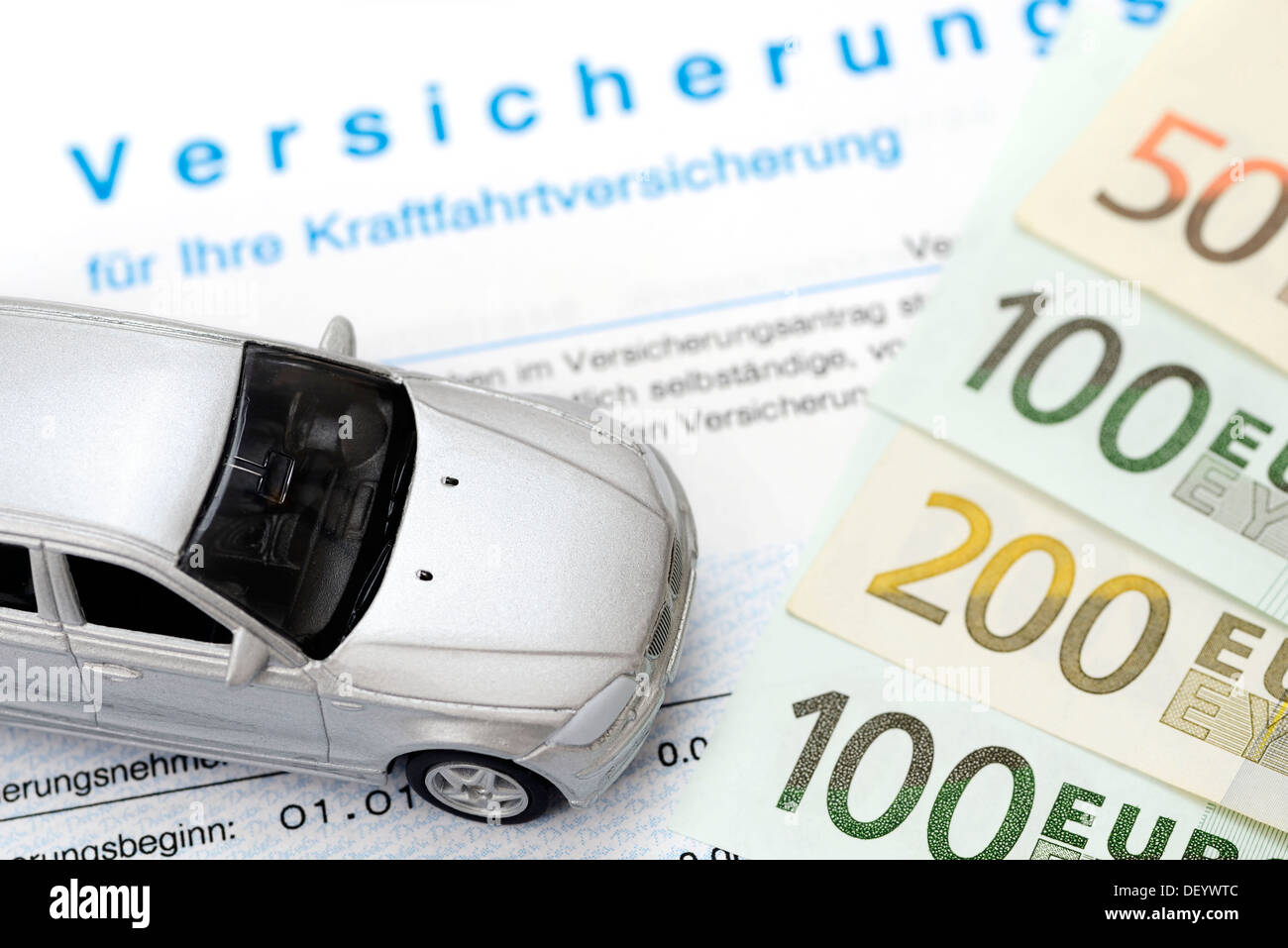 Car insurance contract and miniature car, symbolic image for a rise in ...