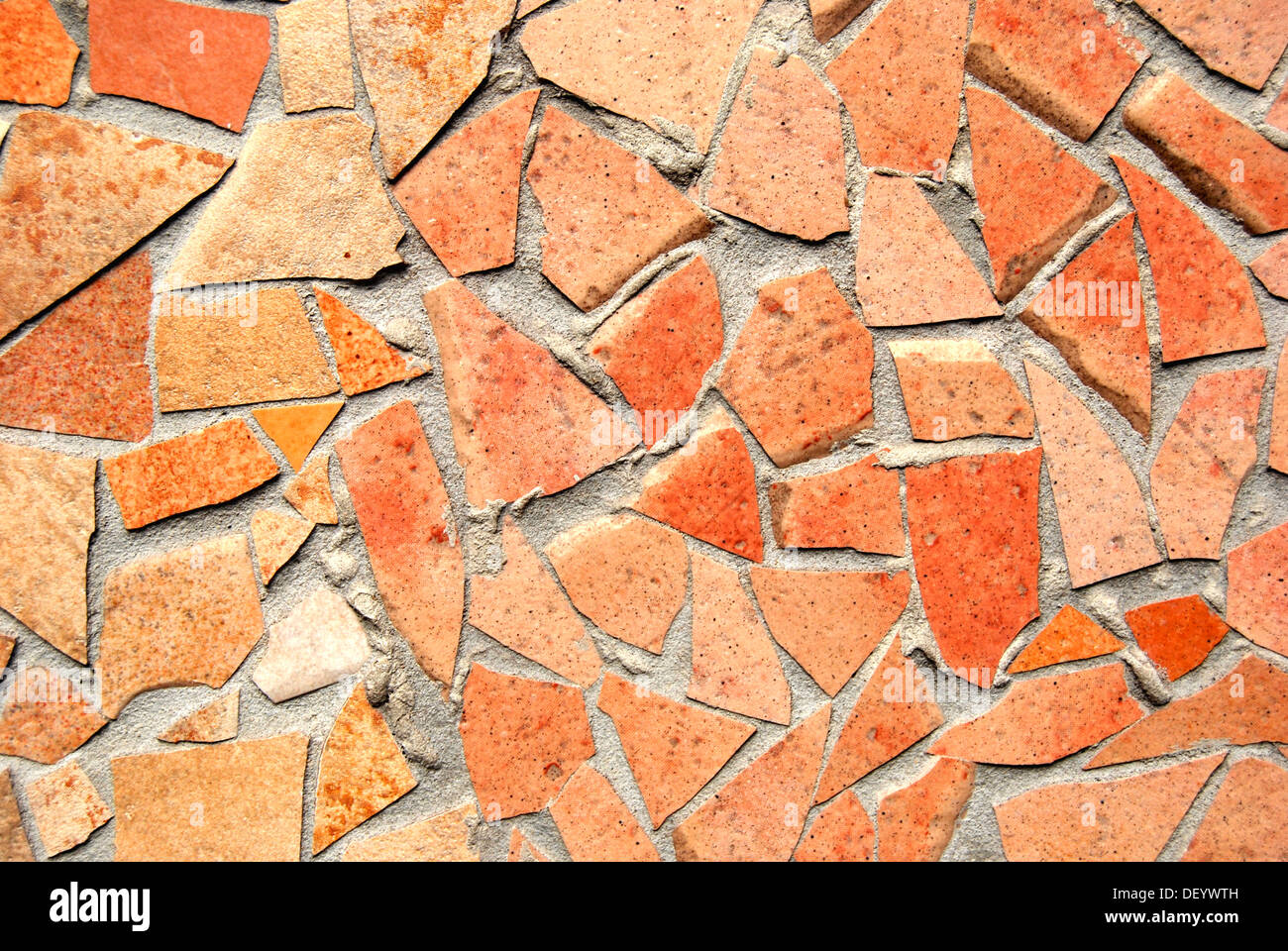 Mosaic from broken tiles in reddish brown colours Stock Photo - Alamy