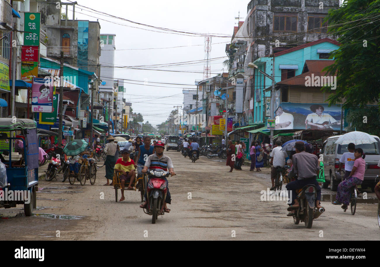 People ride along the Main Road in Sittwe, Burma Stock Photo - Alamy