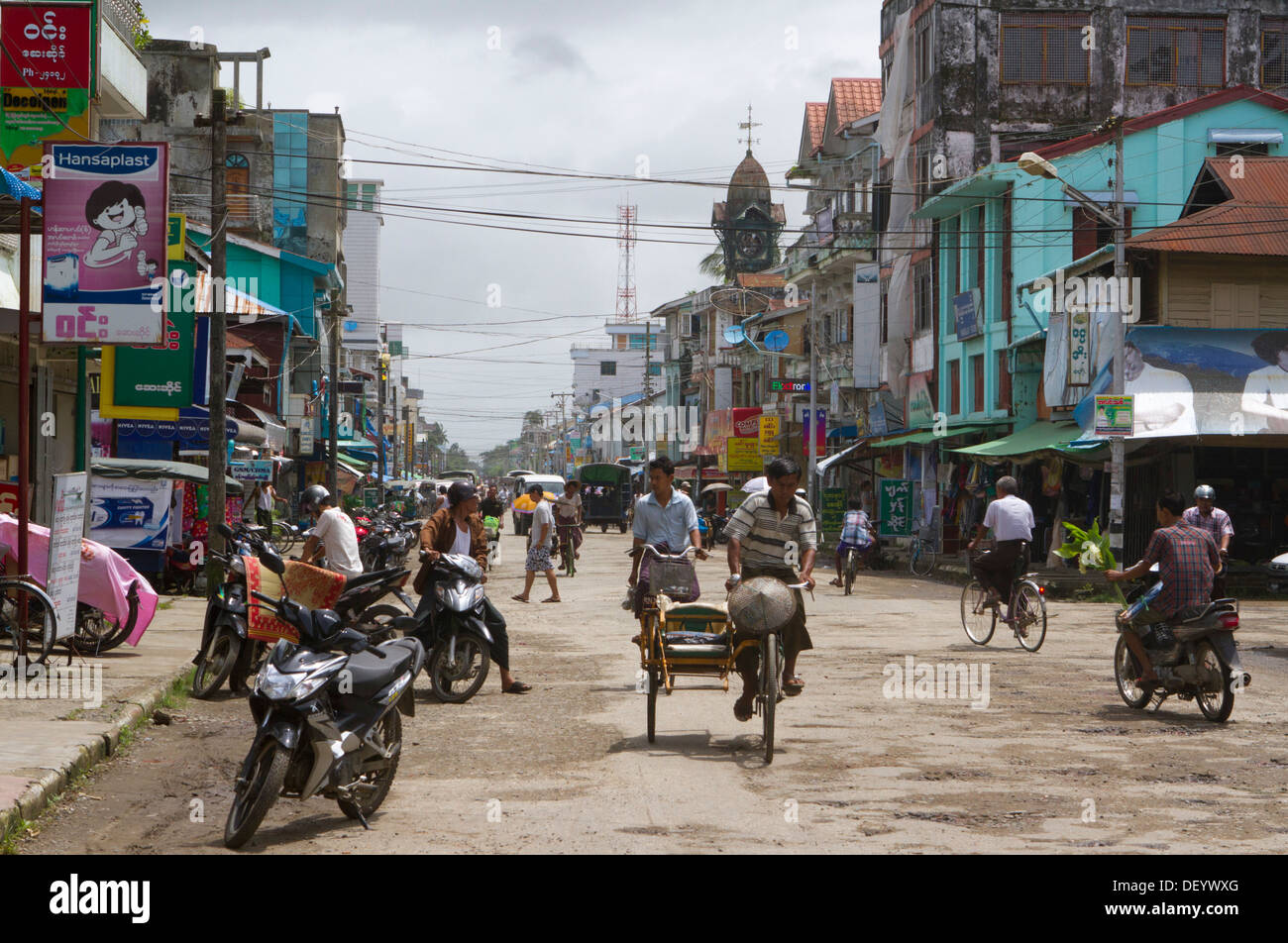 People ride along the Main Road in Sittwe, Burma Stock Photo - Alamy