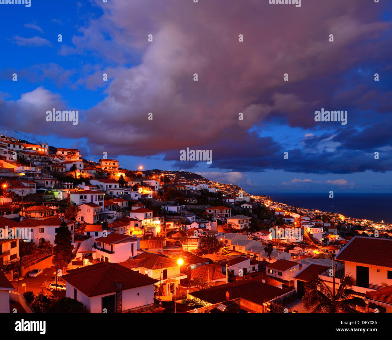 Funchal cityscape at dusk with dark clouds looming overhead, Funchal ...