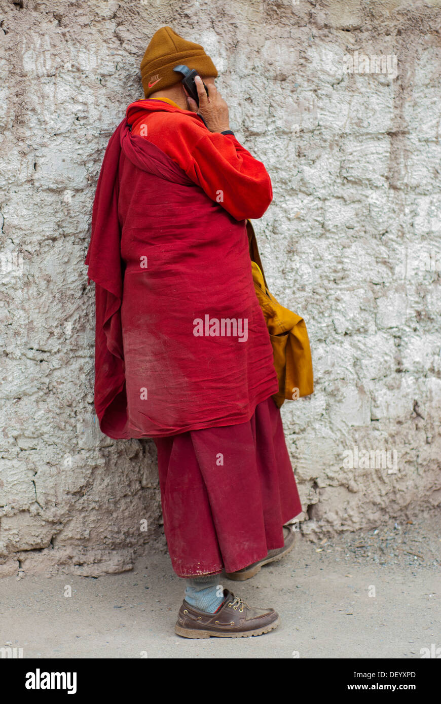 India, Jammu & Kashmir, Ladakh, monk in a fleece hat and red robes ...