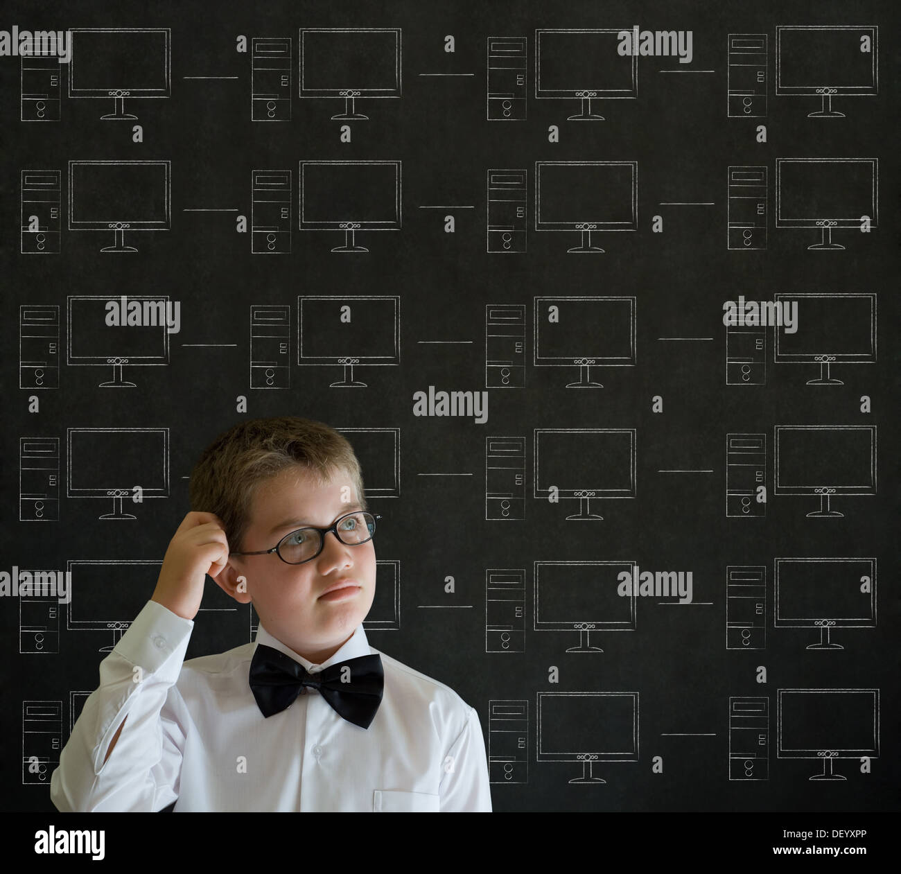 Head scratching boy with chalk networks on blackboard background Stock ...
