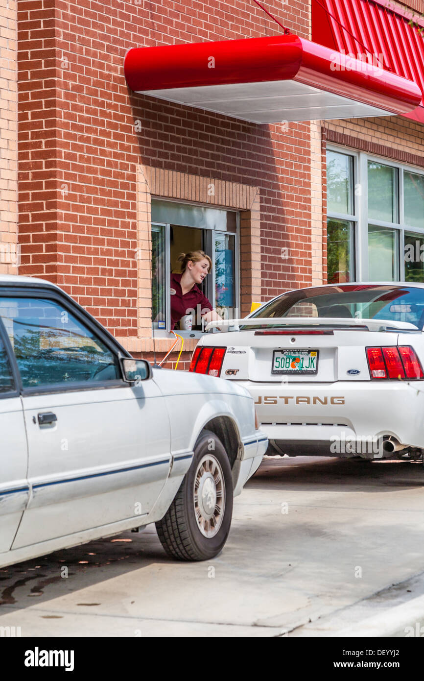 Cars at the drive through window at the Chick-fil-a fast food ...
