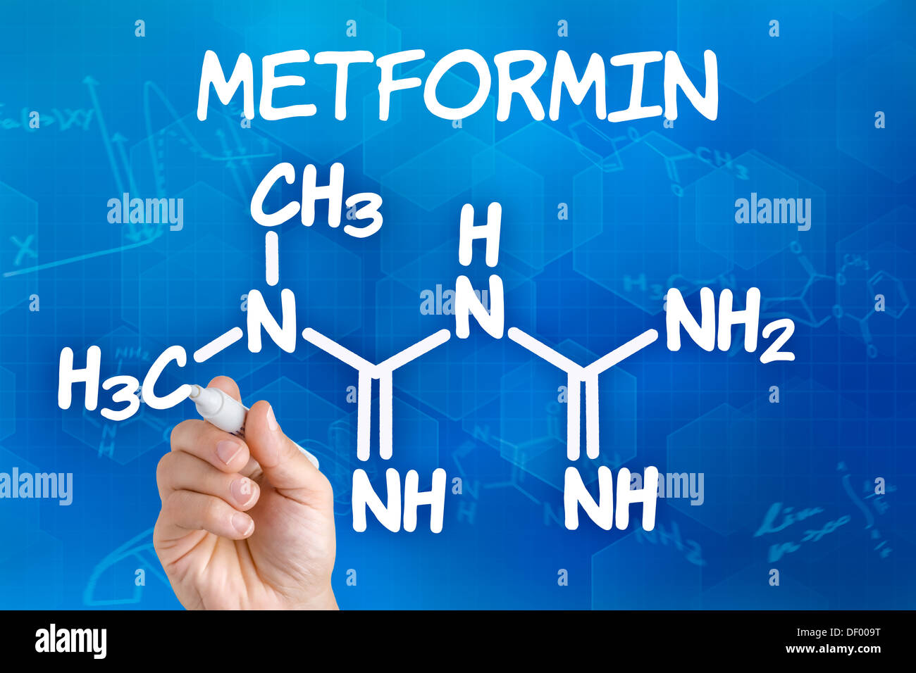 Hand with pen drawing the chemical formula of metformin Stock Photo - Alamy