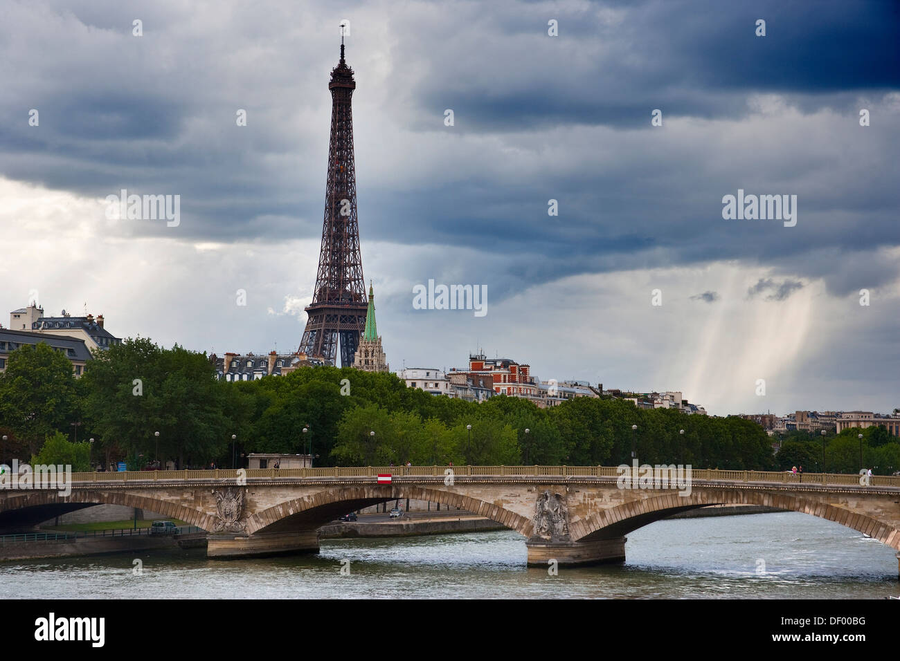 The Eiffel Tower during summer storm in Paris, France, Europe Stock ...