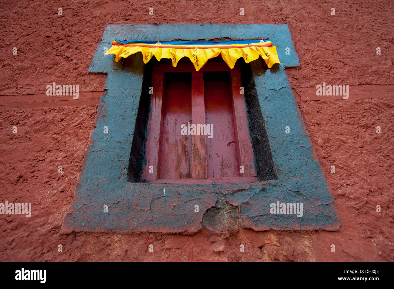 India, Leh, capital of Ladakh, window with red shutters and a yellow ...