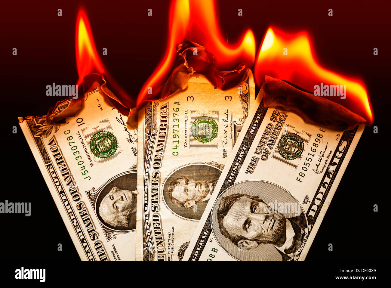 Burning money dollars hi-res stock photography and images - Alamy