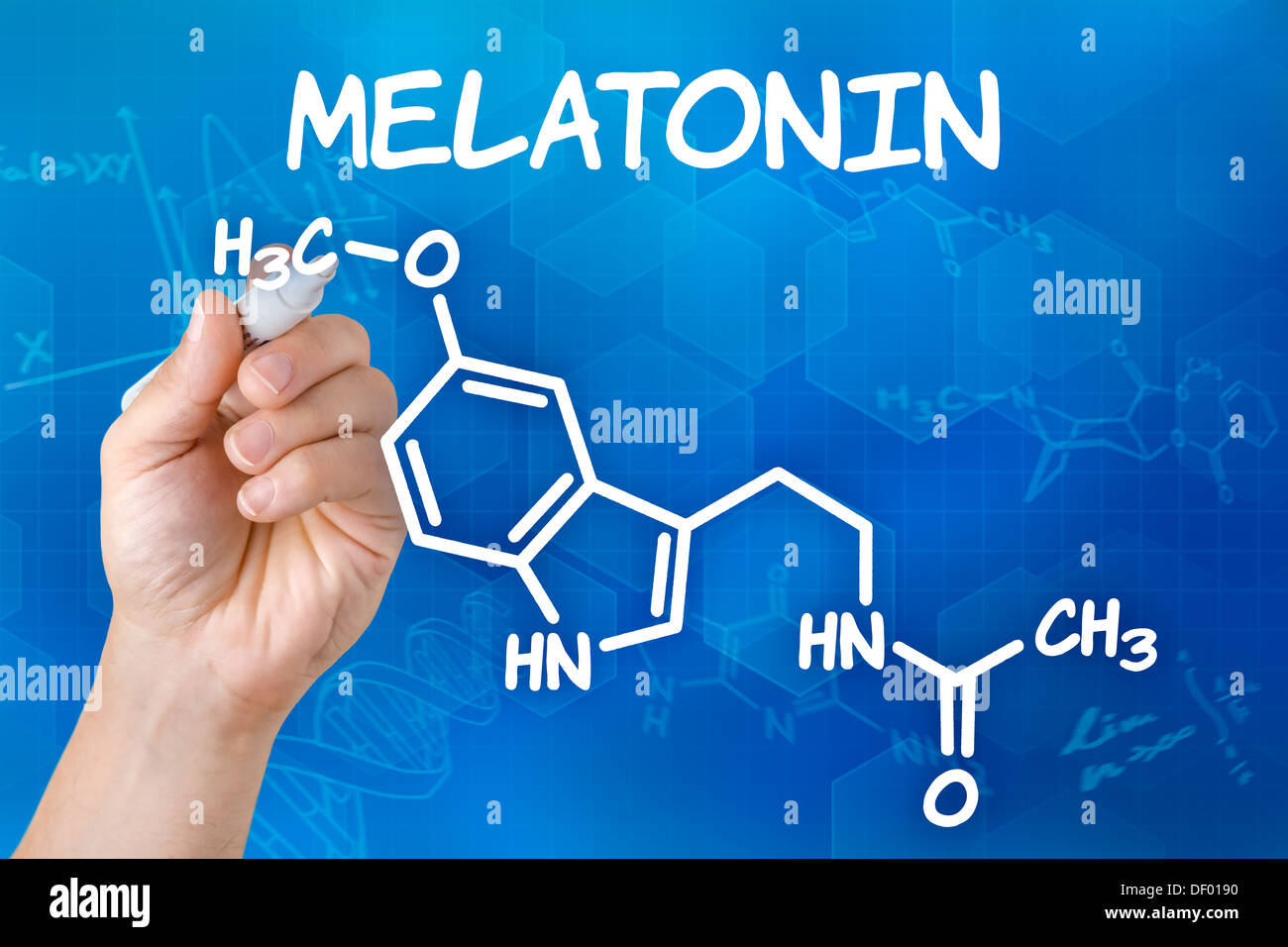Hand with pen drawing the chemical formula of melatonin Stock Photo - Alamy