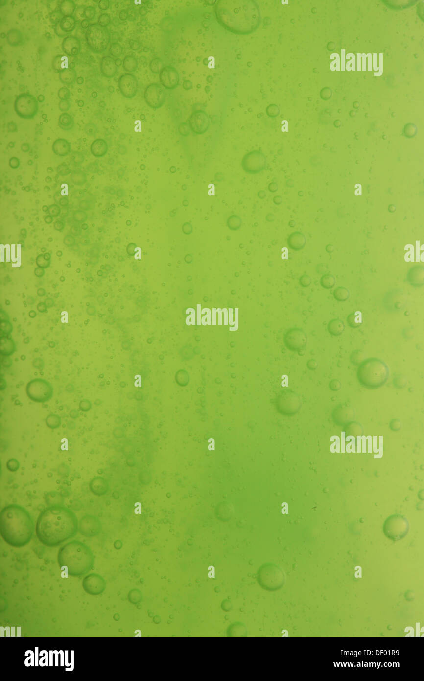 Green abstract blurred liquid background with soap bubbles Stock Photo ...