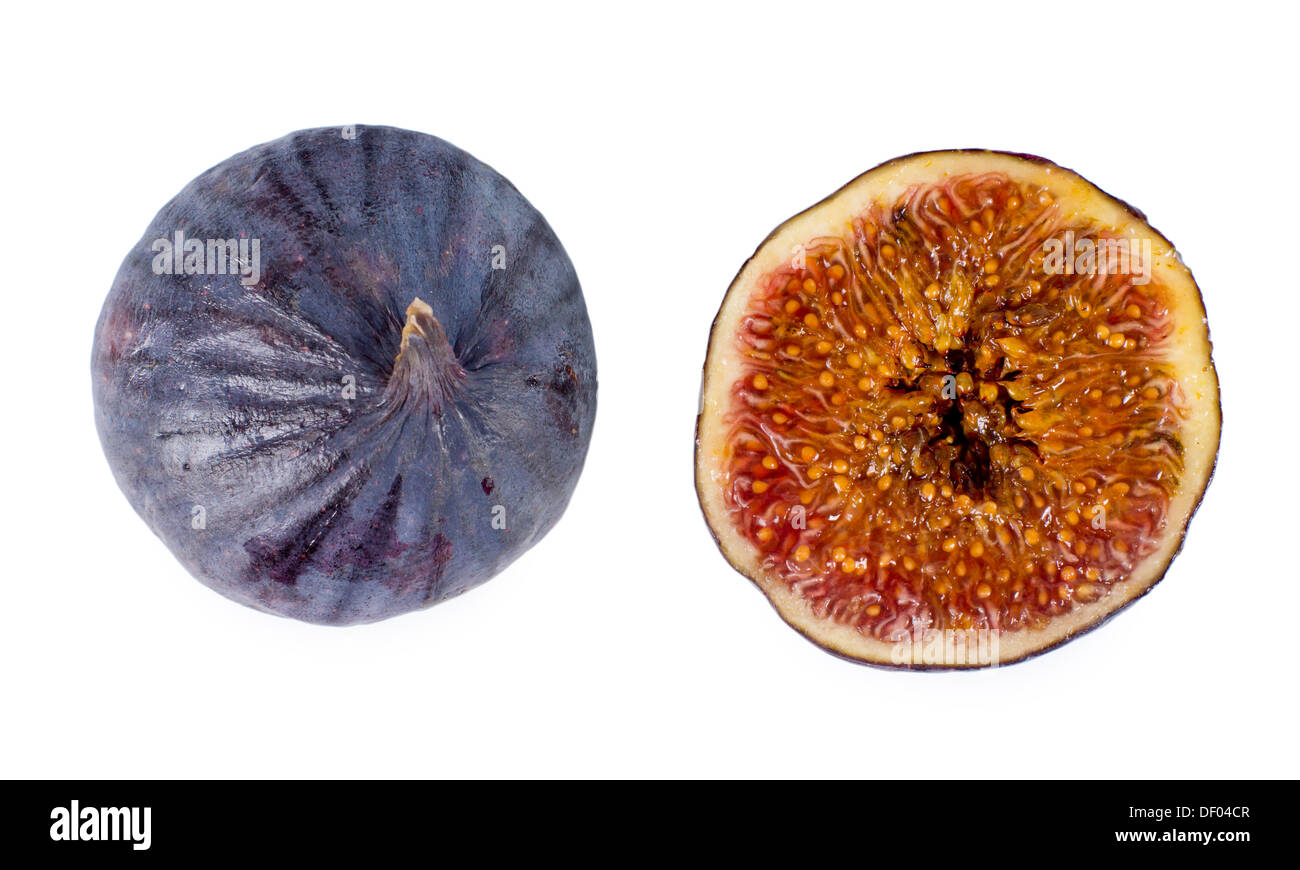 View from above of a whole and halved fresh juicy ripe purple fig ...