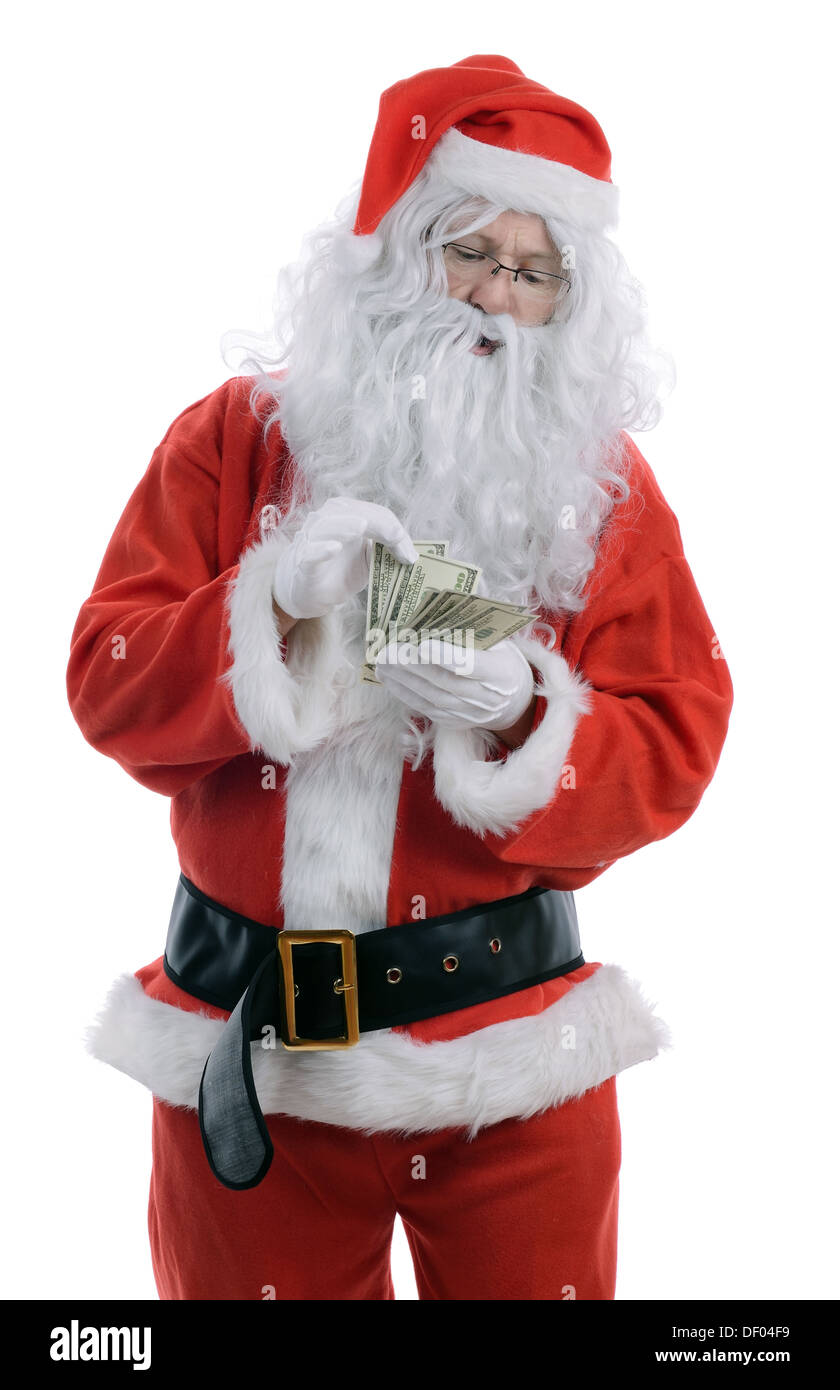 Counting the cost of christmas, santa counting dollars isolated on a ...