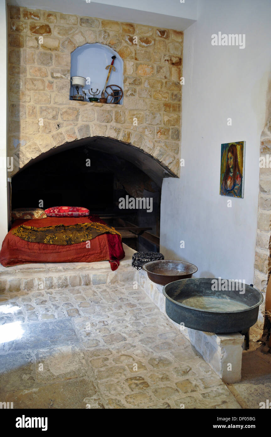 Bed in gallery space in an artist's home, Safed, Israel, Middle East ...