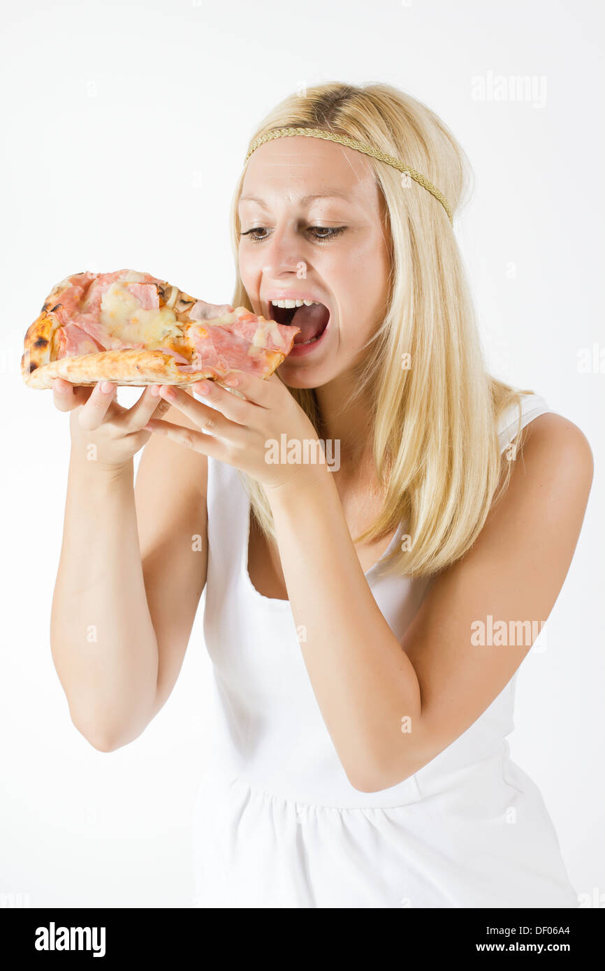 Portrait of beautiful girl eating pizza Stock Photo - Alamy
