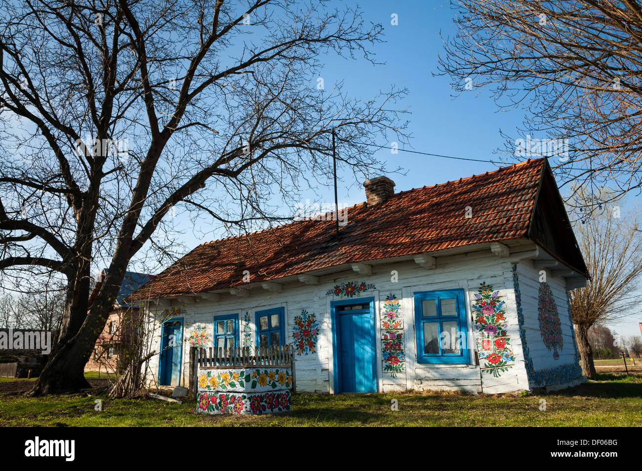 Traditional old wooden house painted with colorful flowers, village ...