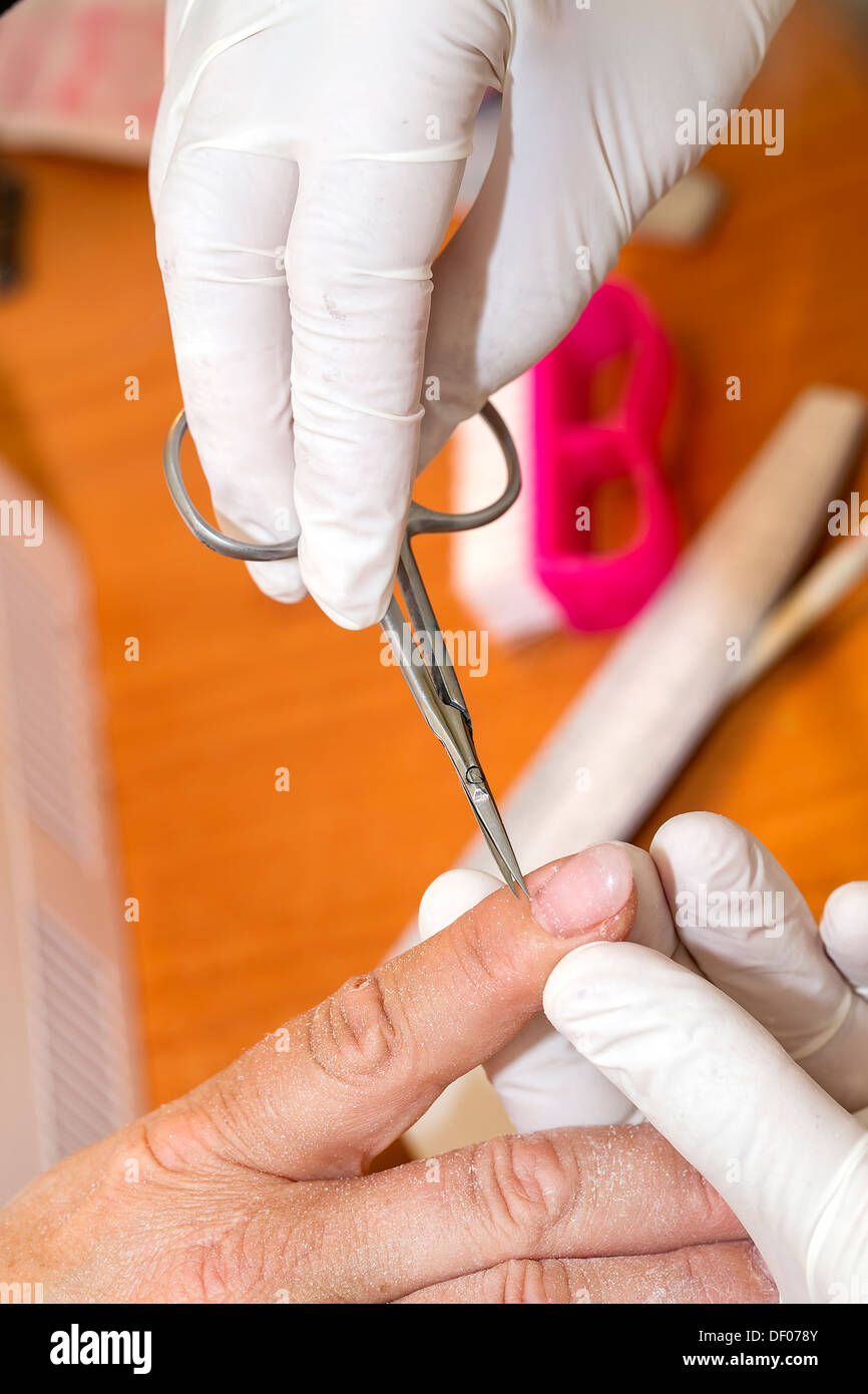 processes work on a manicure in the salon Stock Photo - Alamy