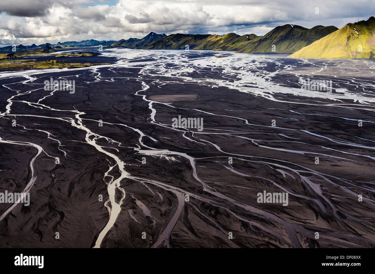Aerial view, moss-covered mountains and the black sand of ...