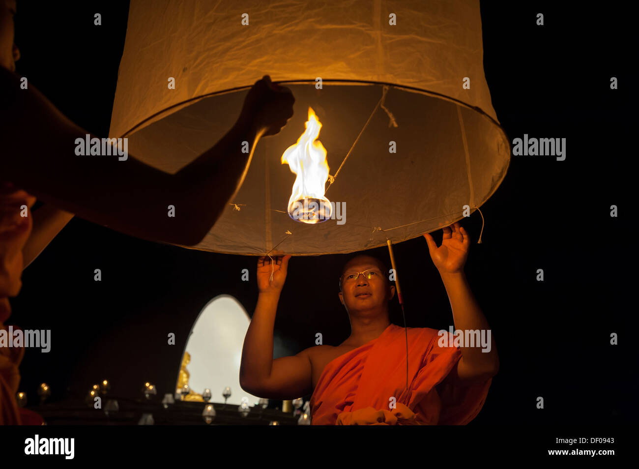 Monks releasing a Kongming lantern or sky lantern for luck during the ...