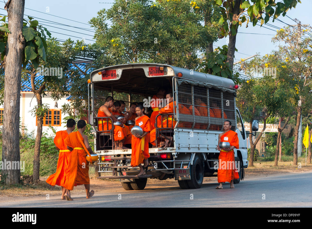 Songthaeo or songthaew, converted vehicle with young Buddhist monks ...